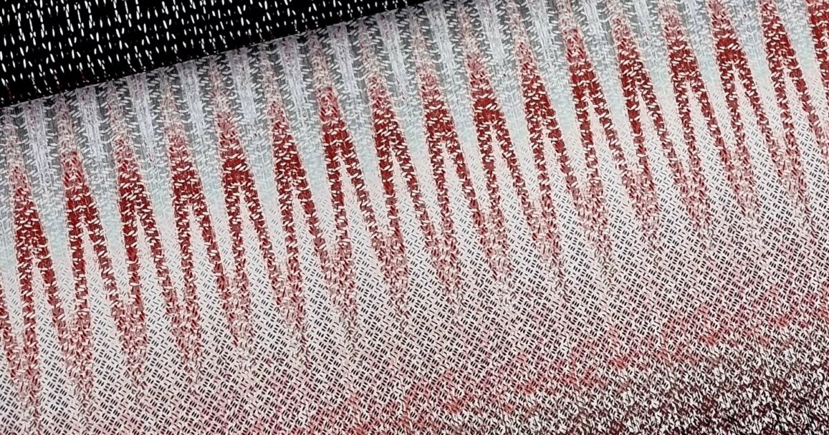 Viscose tricot zigzag overloop zwart/rood | Megastoffen